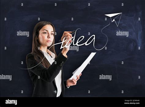 Creative Idea And Strategy Concept With Young Woman On Blackboard
