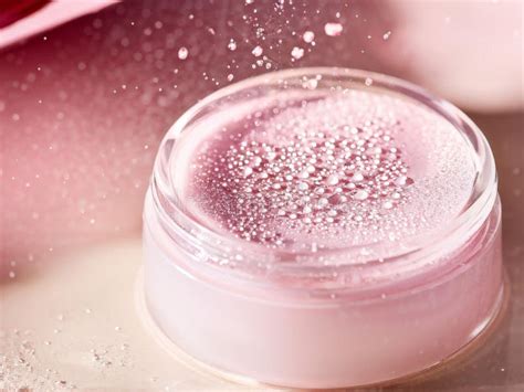 Cosmetic Moisturizer Face And Cream In Pink Background With A Sprig Of Cherry Stock