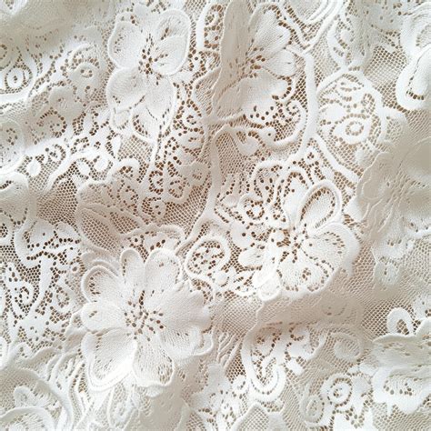 Intricate Lace Pattern On White Fabric Premium Ai Generated Image