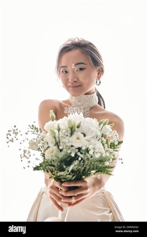 Attractive Young Asian Woman With Grace Makeup Hold Out Bouquet Of