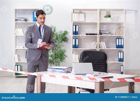 The Forensics Investigator At The Scene Of Office Crime Stock Image