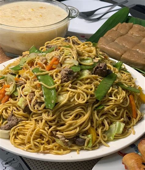 Pinoy Food Pancit Canton Lumpia Shanghai Kalamay And Ginataang Mais