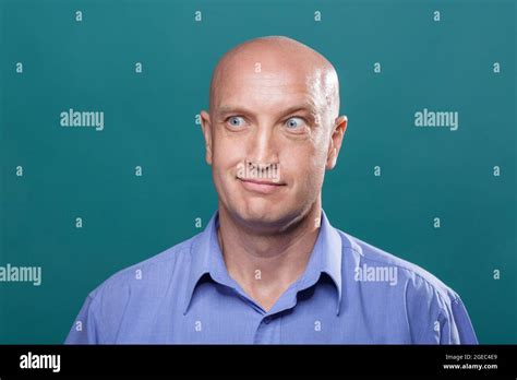 Portrait Of A Bald Man On A Blue Background Model In Her 40s Blue