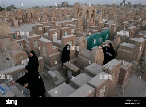 Relatives Light Candles And Recite Verses Of The Holy Quran As They Pay