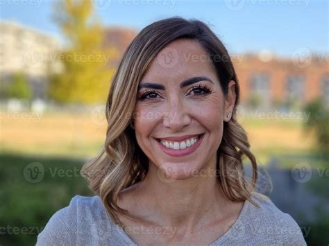 Happy Middle Aged Woman In An Urban Park Attractive Female Smiling To