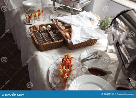 Catering A Bread Basket With Cutlery And Snacks For Cocktail Parties
