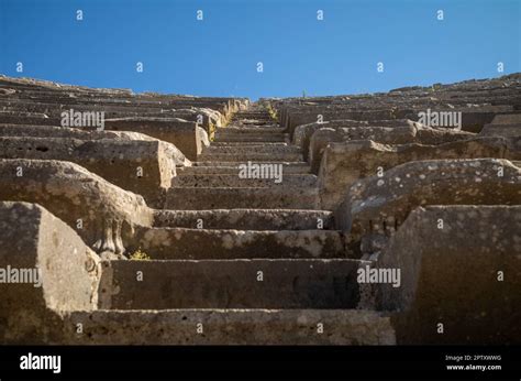 Looking Up Steep Steps Past Rows Of Stone Bench Seating At The