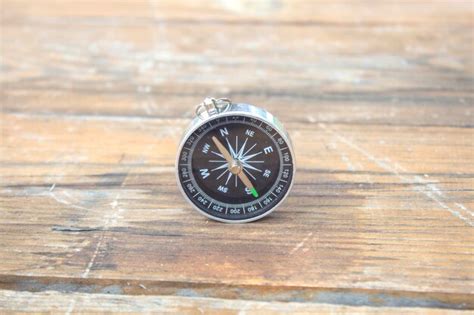 Premium Photo Compass On The Wooden Table