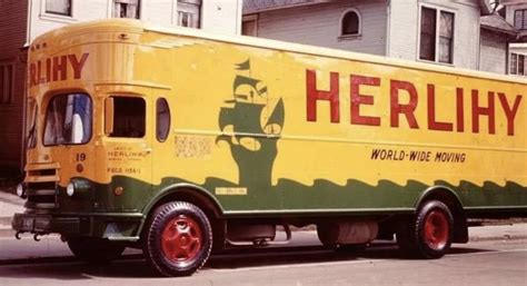 Custom Yellow And Green Delivery Truck Parked In Front Of Houses Old