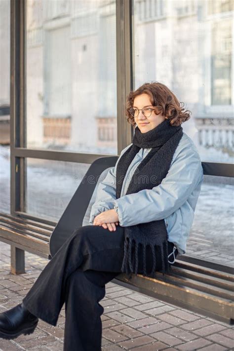 Teenage Girl Waiting For Public Transportation Girl At The Bus Stop