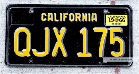1963 Yellow On Black California License Plate With A 1966 Sticker