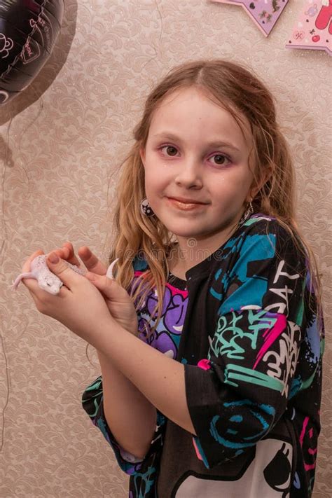 A White Bellied Lizard A White Lizard Is Sitting On The Girl S Arm