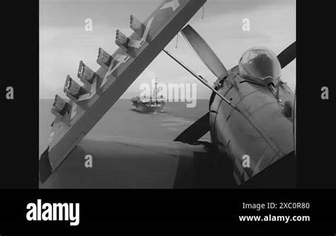 1954 An F9f 7 Is Lowered On The Deck Edge Elevator Of The Uss Hornet