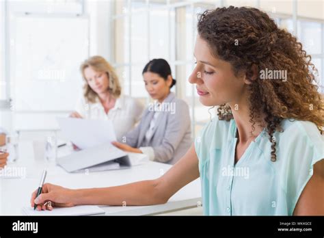 In The Casual Businesswoman Taking Notes During Meeting Office Stock Photo Alamy