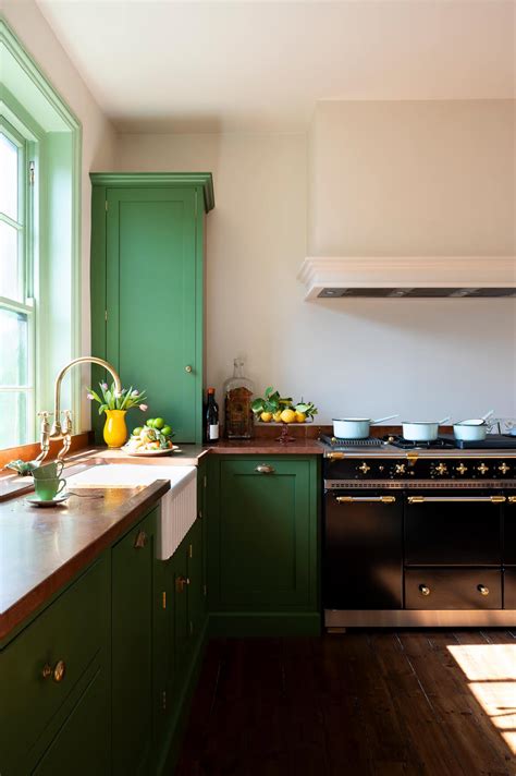 A Small Green Devol Kitchen In A 17th Century London Mews House The