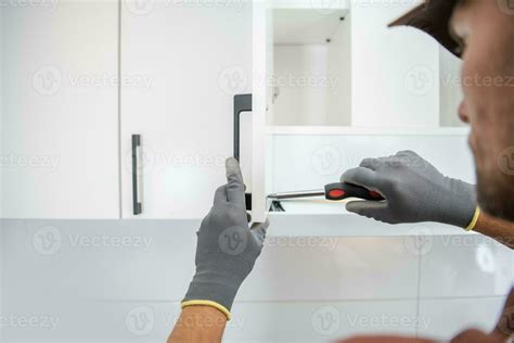 Cabinetmaker Contractor Worker Assembling Kitchen Cabinets 24628183