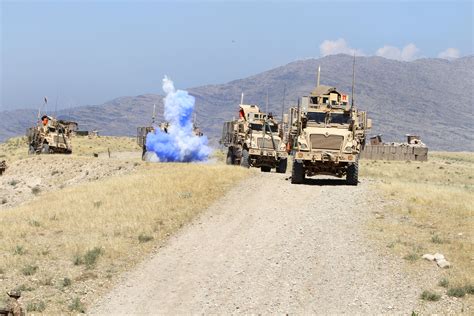 A Convoy Of Us Vehicles Evades A Simulated Improvised Explosive