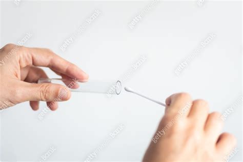 Hands Inserts A Saliva Sample In The Test Tube 이미지 1220195803 게티이미지뱅크
