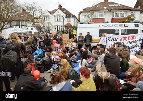 A Large Group Of Demonstrators From The Direct Action Group Uk Uncut Gather Outside What Is