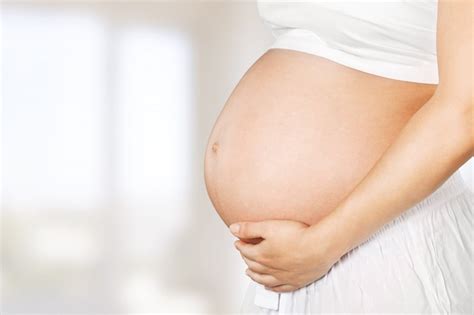 Premium Photo Close Up Of A Cute Pregnant Belly