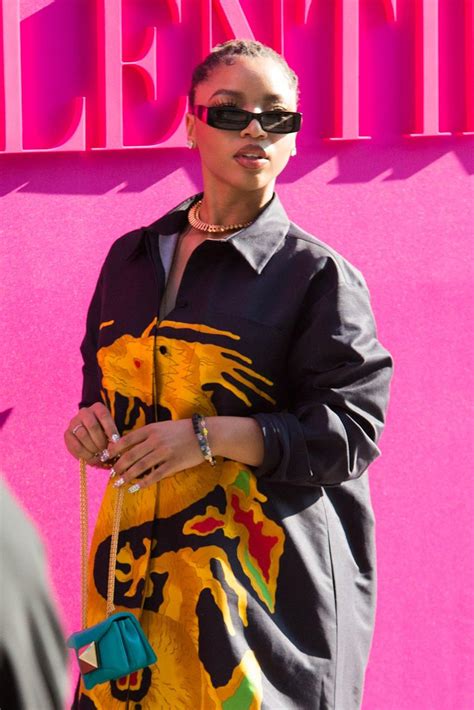 Chloe Bailey Soars In 6 Inch Metallic Gold Heels With Dragon Graphic