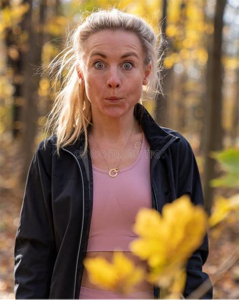 A Young Girl In Sports Uniform Sports Jogging In The Autumn Park