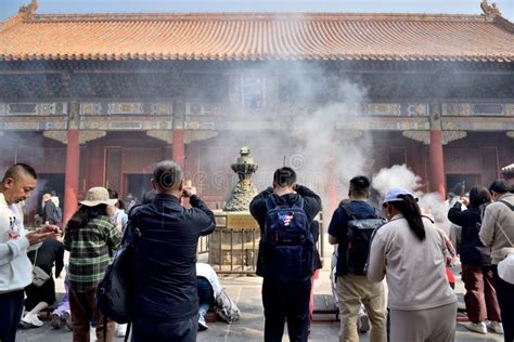 People Burning Incense And Praying In Yonghe Temple Of Tibetan Buddhism