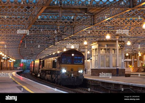 Db Cargo Rail Class 66 Diesel Locomotive 66063 Passing The Station At