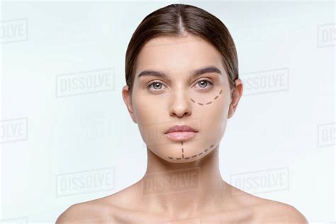 Portrait Of Young Woman With Correction Lines Isolated On White