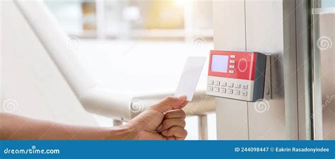 Close Up Hand Security Man Using ID Card Scanning At The Access Control System For Identity