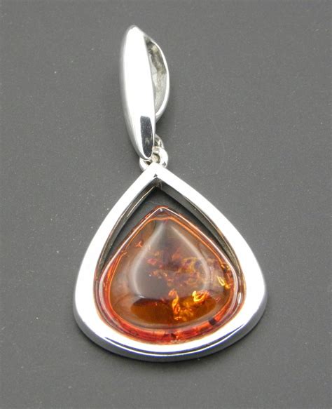 Small Amber Teardrop Pendant Sterling Silver Stylish Setting