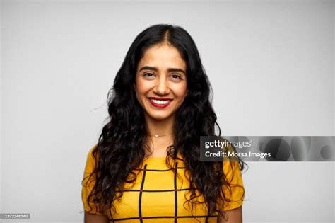 Smiling Beautiful Mexican Young Woman With Long Wavy Hair High Res