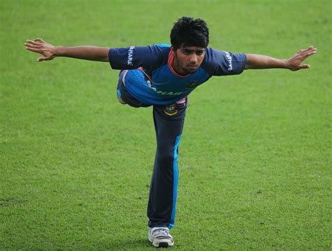 Mominul Haque Stretches During A Training Session