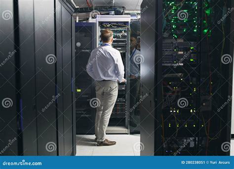 Doesnt Look Like We Have Any Issues Here Rearview Shot Of A Mature Man Working In A Server Room