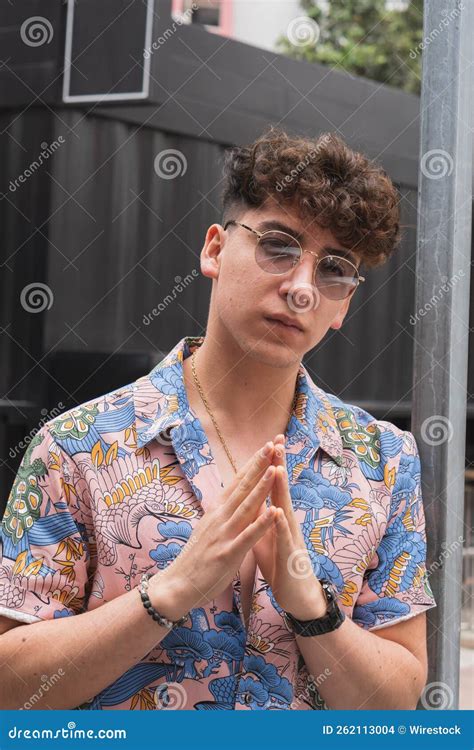 Attractive Latino Man With Curly Hair And Sunglasses Outdoors Stock
