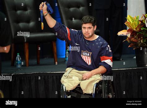 Paralympian Gold Medalist Retired Marine Cpl Paul Schaus Holds Up His Gold Medal From The Sochi