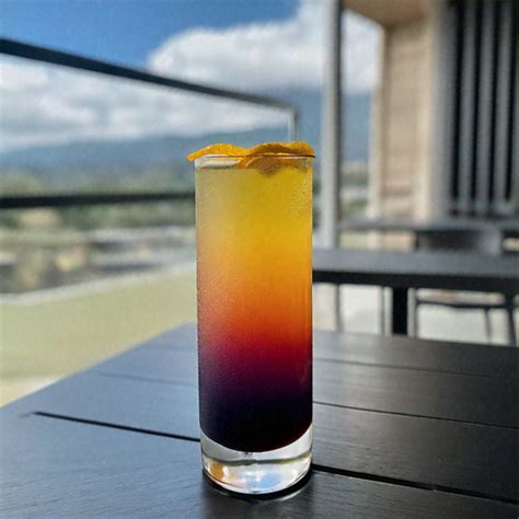 Solar Eclipse Exotic Cocktail With Spiced Rum Passion Fruit