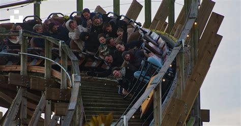 People Riding A Wooden Roller Coaster Descent Photo Free Holiday