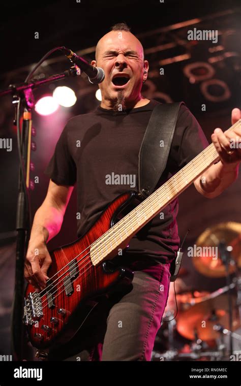 Bassist Joey Vera Is Shown Performing On Stage During A Live Concert