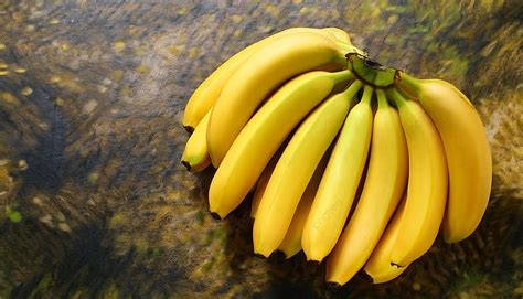 A Bunch Of Ripe Yellow Bananas Background Banana Bananas Fruit