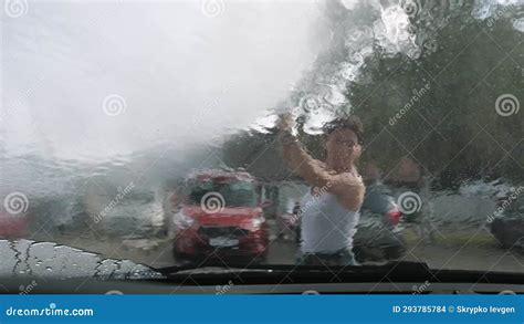 Girl Washing Car Window At Touchless Car Wash Under High Pressure Stock