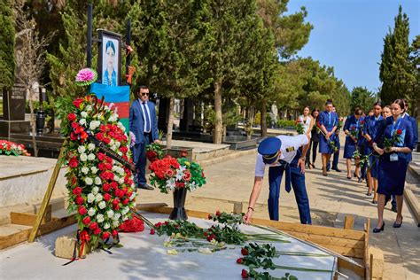 Management And Staff Of Azal Visit Grave Of Azerbaijans National Hero Hokuma Aliyeva