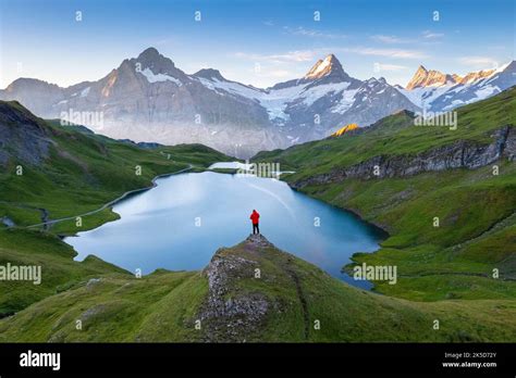 Aerial View Of A Person Admiring The Bachalpsee Lake During A Summer