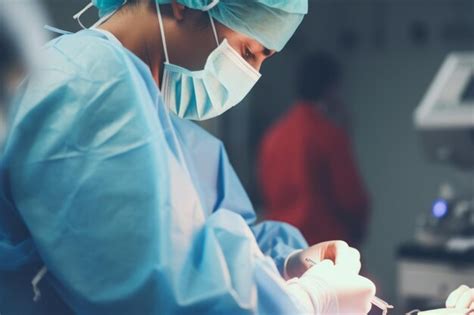 Premium Photo Young Experienced Surgeons Performing Operation Saving Patient Life Doctor