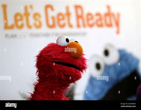 Elmo Attends A Presentation During A Visit By Sesame Street Characters