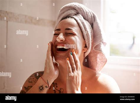 Do Whatever Makes Your Soul Vibe A Young Woman Giving Herself A Facial