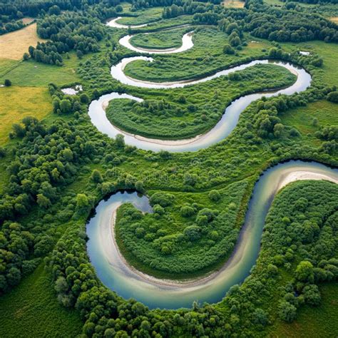 Winding River Forms A Series Of Sharp Serpentine Bends Through Lush