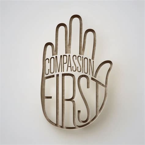 Metallic Sculpture Of Open Hand With Text Compassion First Stock