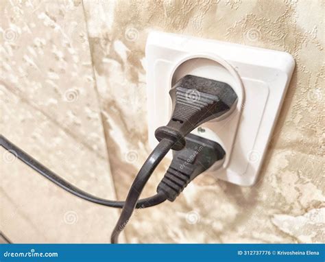 Cables Connected To Power Sockets Against A Decorative Wall Dual Electrical Outlets With