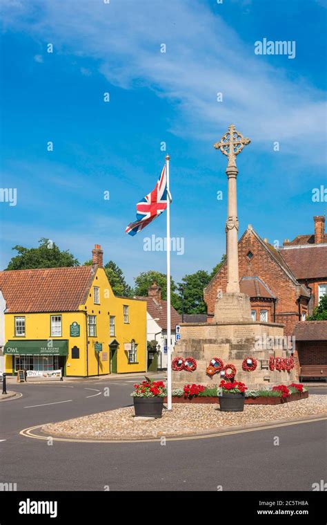 Holt Norfolk Uk View In Summer Of The Market Place In Holt Village Showing The War Memorial At